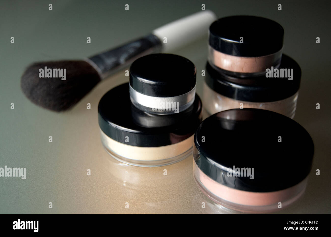 Mineral makeup pots and cosmetic brush Stock Photo - Alamy