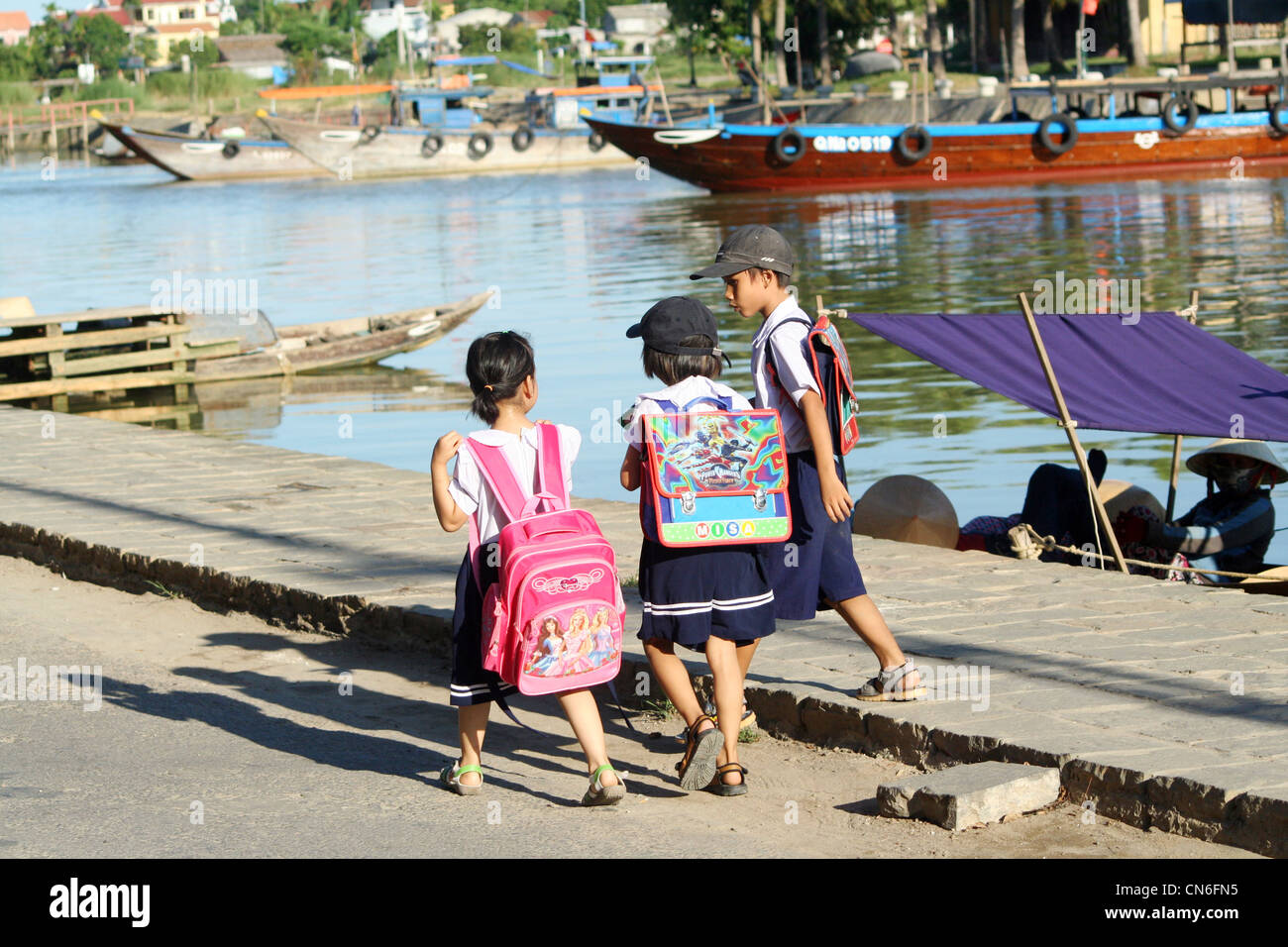 Vietnamese school children on their way home in Hoi An, Vietnam Stock ...