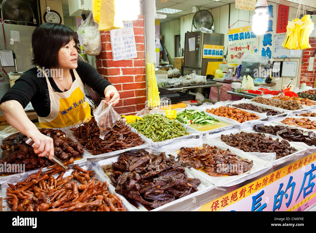 Chicken's feet on sale on food stall in Jishan Street Market Jiufen ...