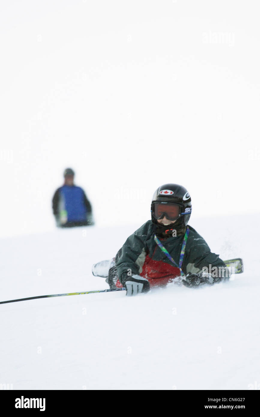 Boy Skier Falling Down Ski Slope, Alberta Rocky Mountains Stock Photo ...