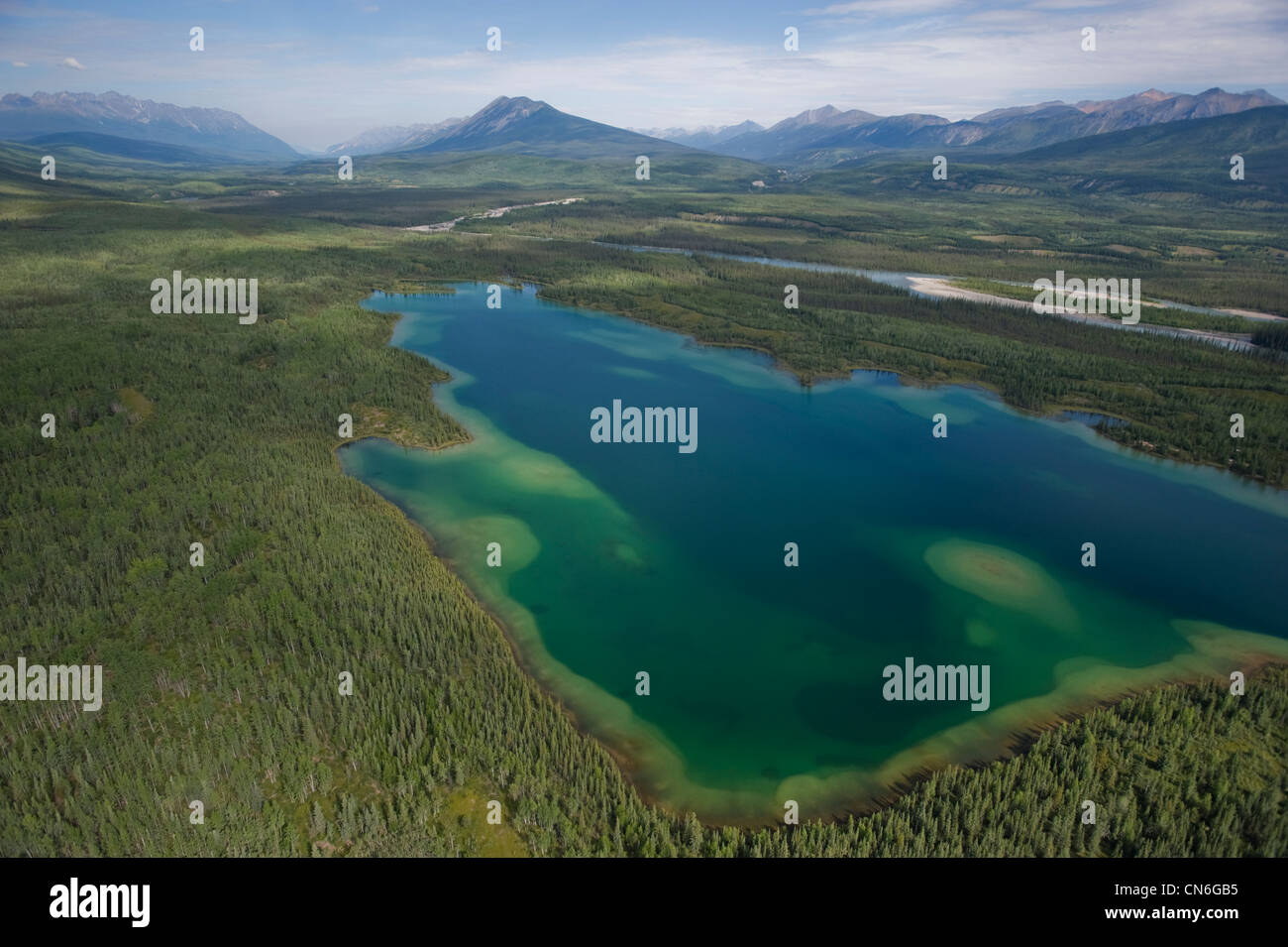 Aerial view of multi-colored Rabbitkettle Lake, Nahanni National Park ...