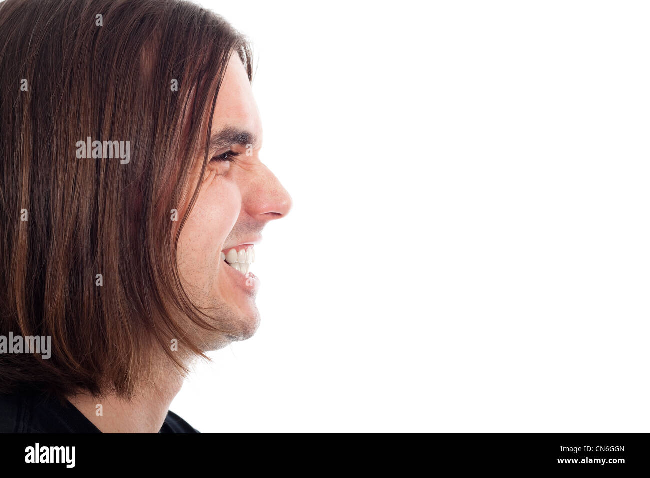 Profile of young long haired happy man face laughing, isolated on white ...