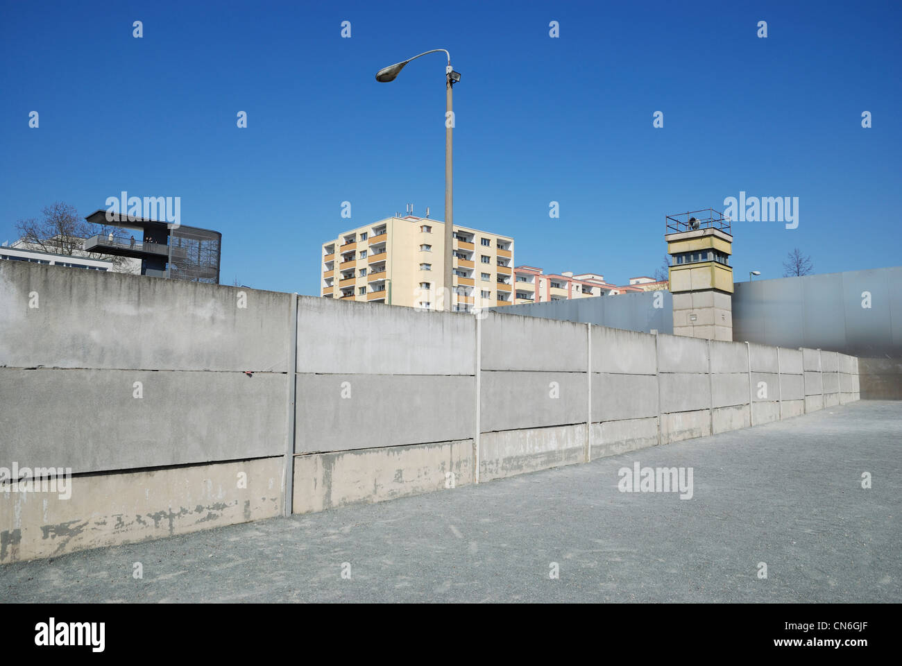 A section of the inner wall and watchtower at the Berlin Wall Memorial ...