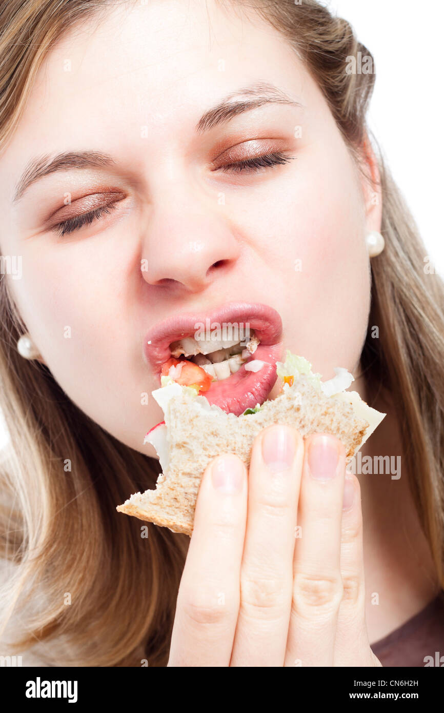 Close up of happy woman eating homemade sandwich Stock Photo - Alamy