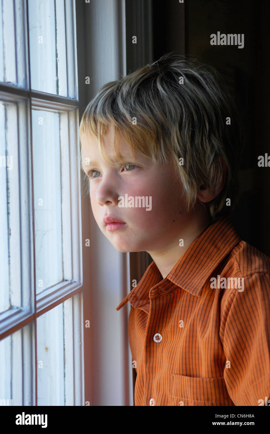 Young Boy Looking out Window, Toronto, Ontario Stock Photo - Alamy