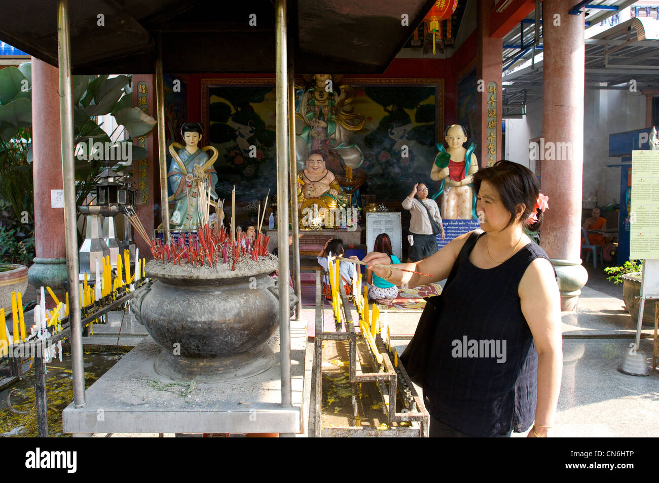lady praying,kuan yim temple,chiang mai,thailand Stock Photo - Alamy