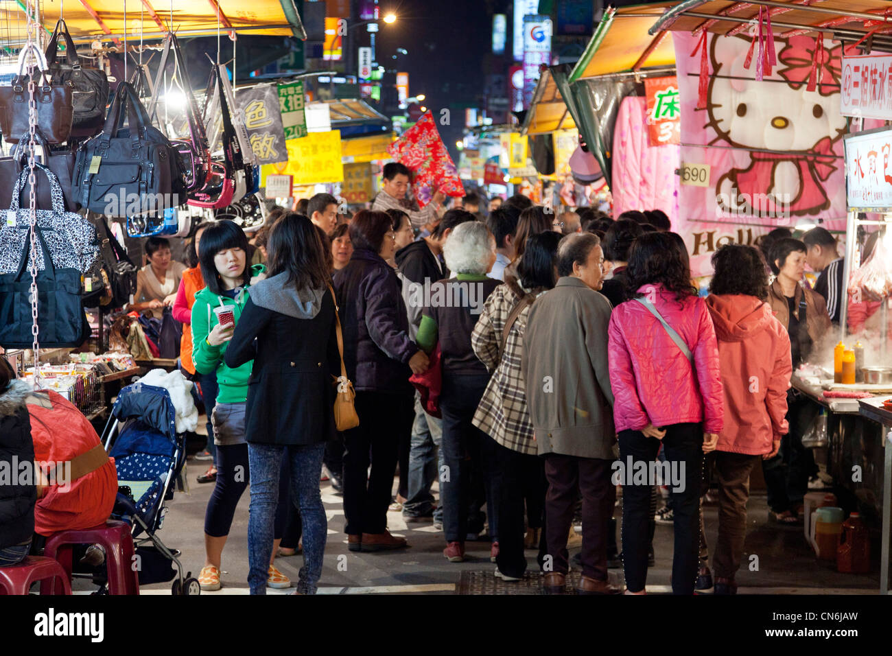 Shoppers in Keelung (Jilong) Temple Plaza Night Market, Miaokou Yeshi ...