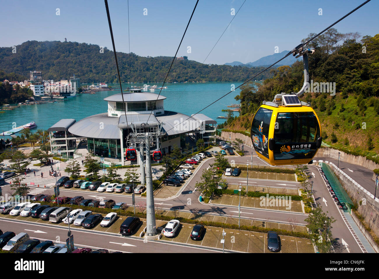 Ropeway cable car gondolas with Station and Sun Moon Lake beyond ...