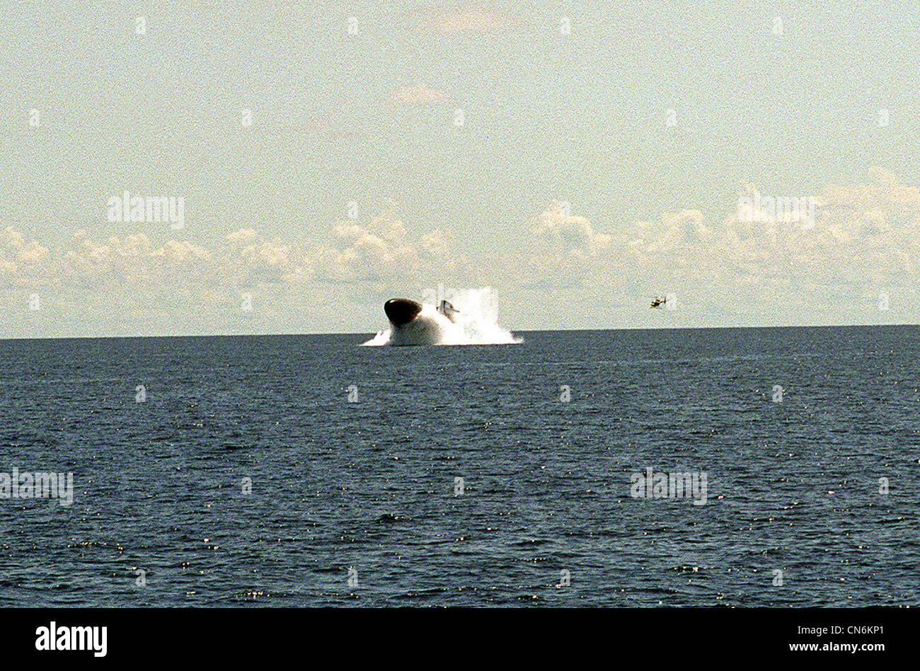 The nuclear-powered attack submarine USS PITTSBURGH (SSN-720) surfaces ...