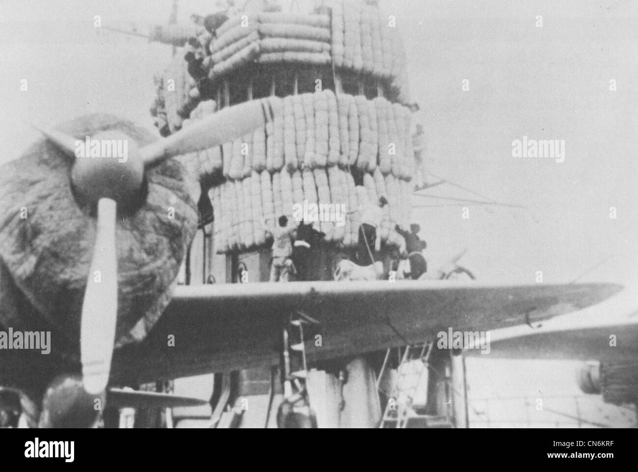 Crewmen aboard the Imperial Japanese Navy aircraft carrier Akagi lash ...