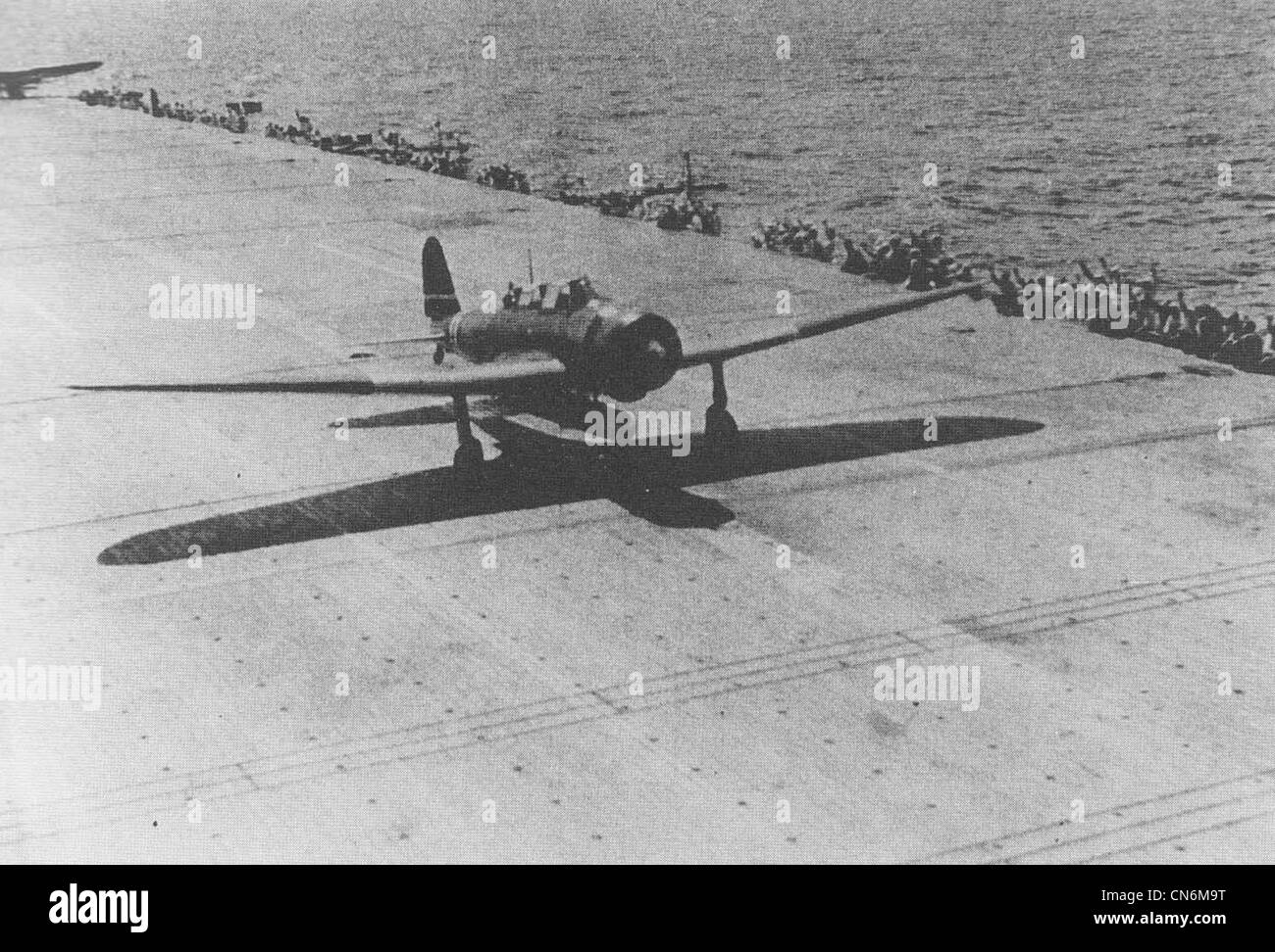A Nakajima B5N2 Type 97 carrier attack aircraft equipped with a torpedo ...
