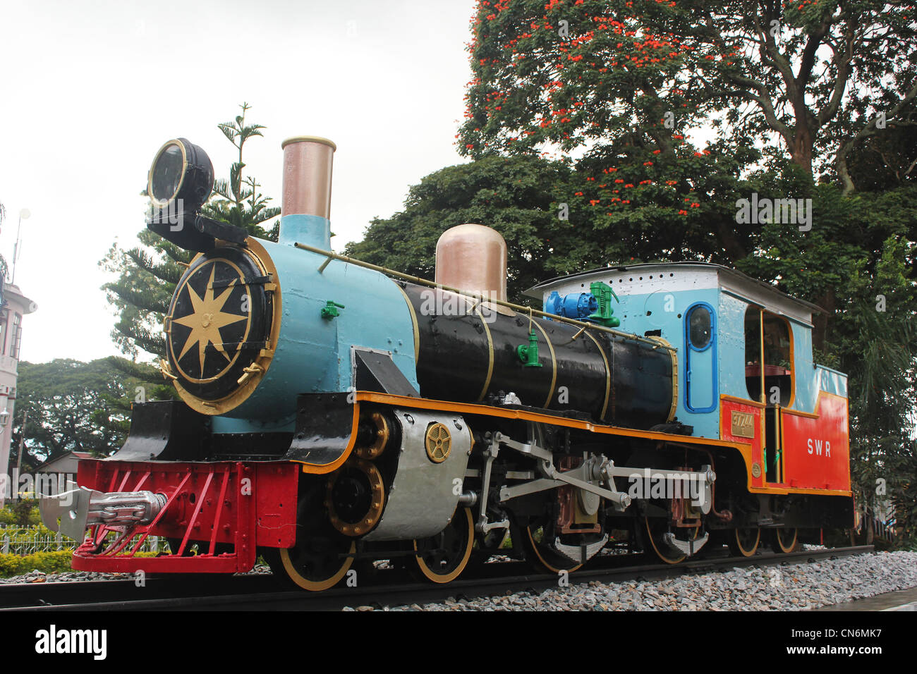 Colorful old train engine kept for display in front of Mysore Railway ...