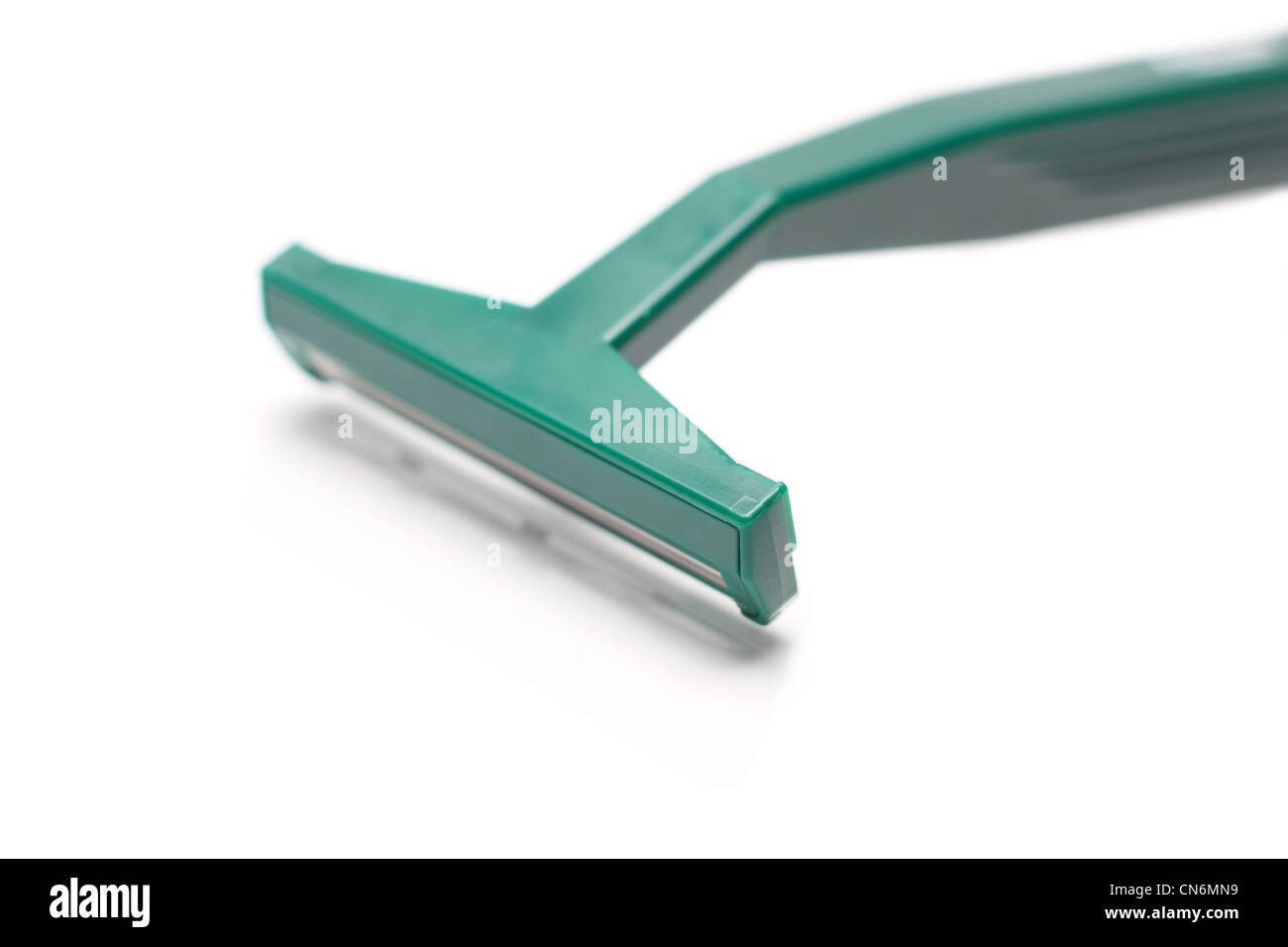 Green manual shaving on a white background Stock Photo - Alamy