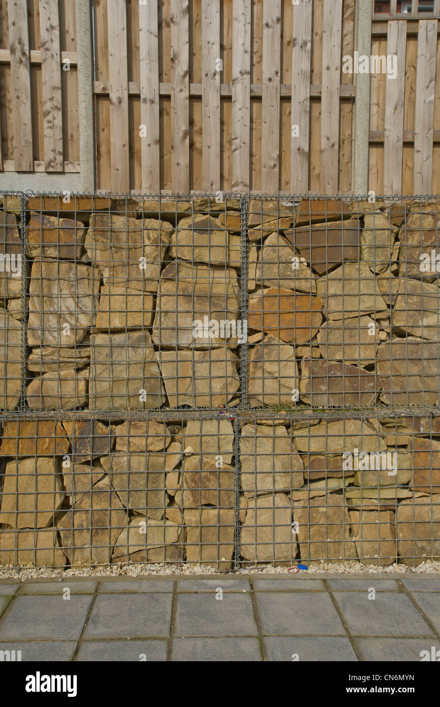 Gabions Wire Cages Rock Wall New build social housing Stock Photo - Alamy