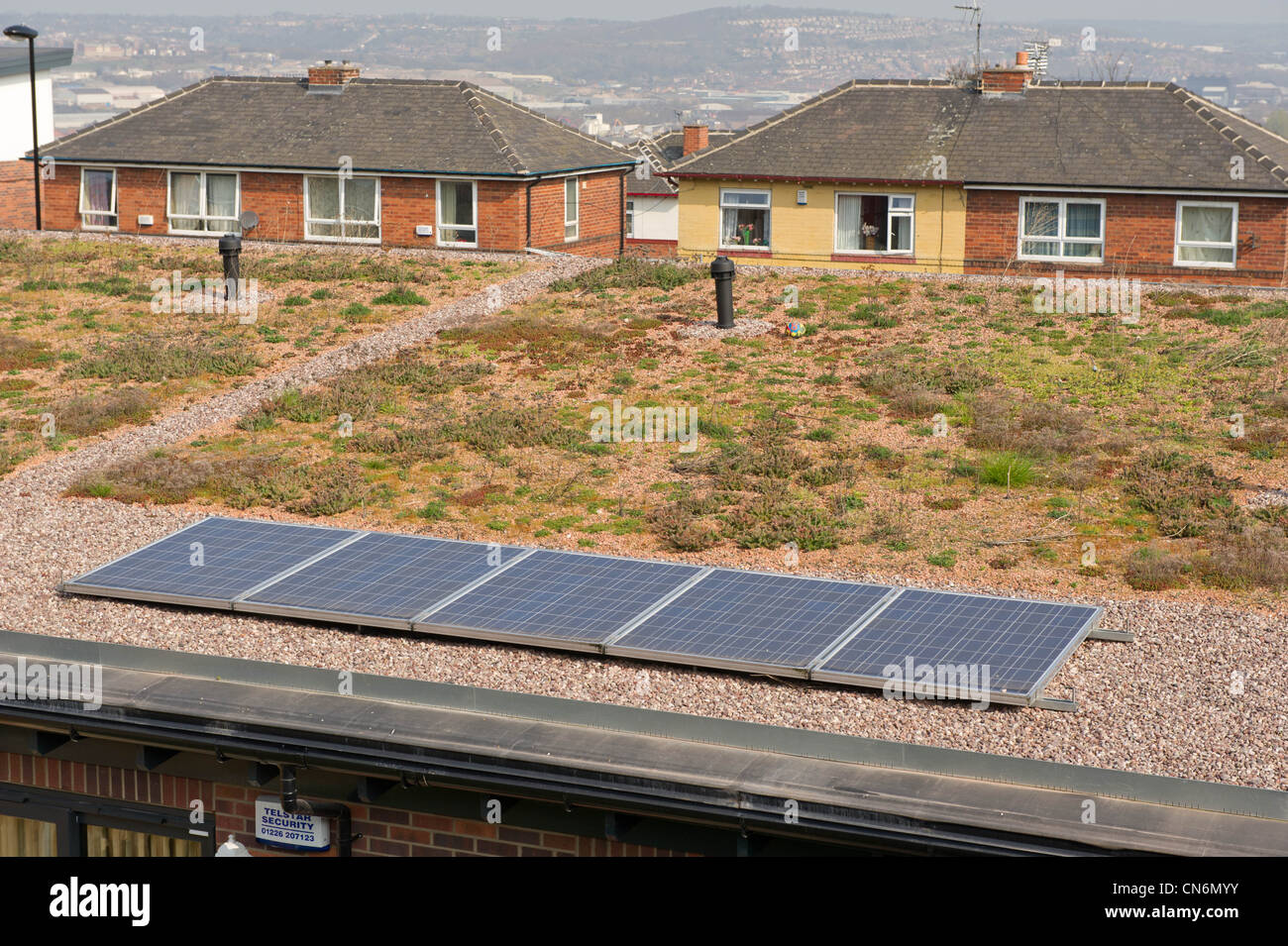 New build social housing with solar panels and a green roof Stock Photo ...