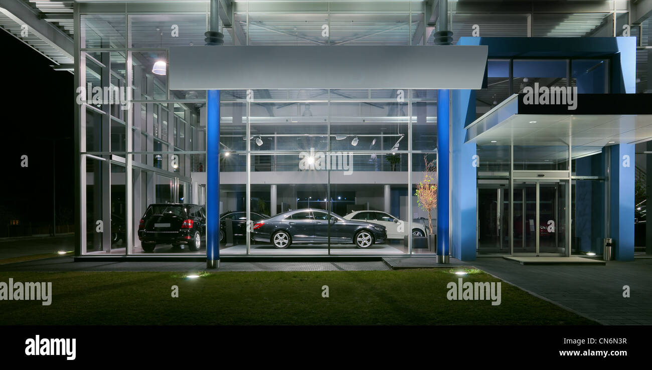 Exterior of a modern car salon, night scene Stock Photo - Alamy