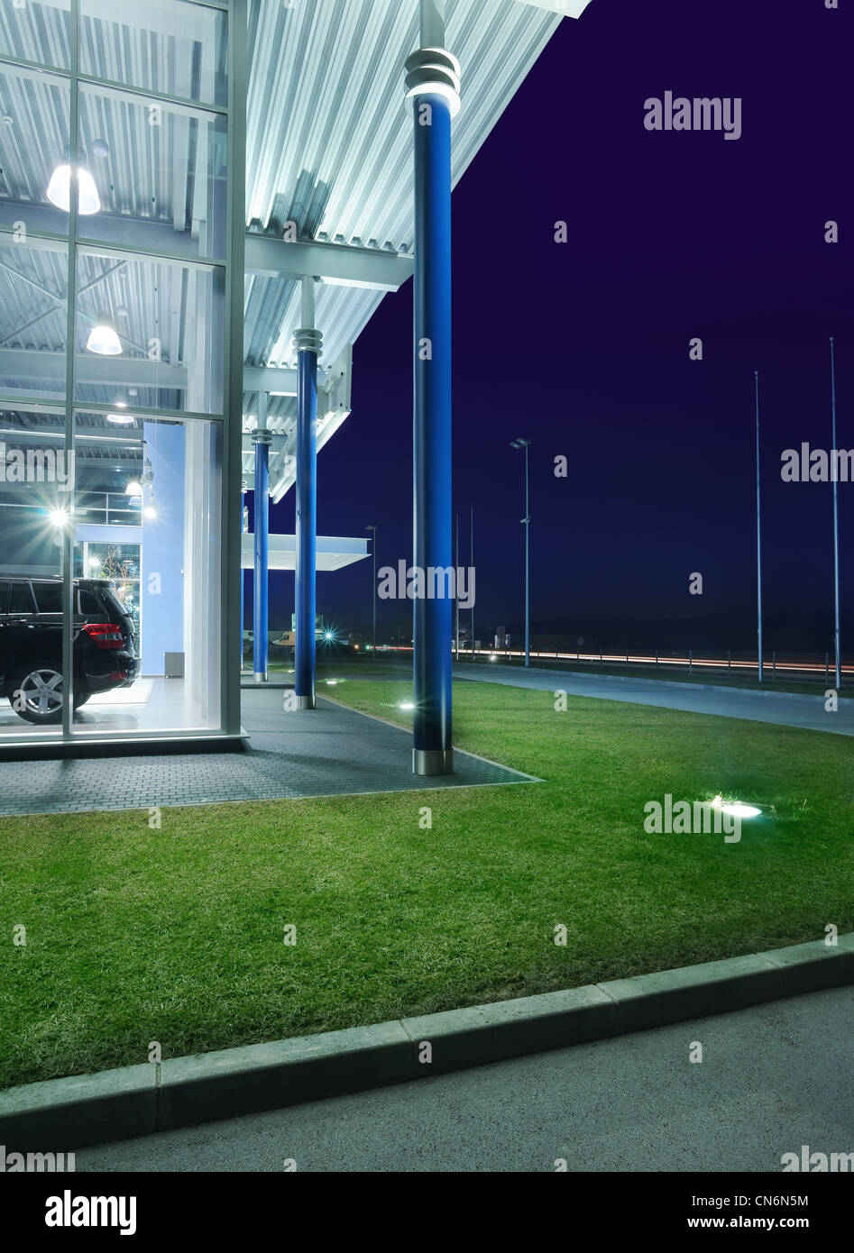 Exterior of a modern car salon, night scene Stock Photo - Alamy