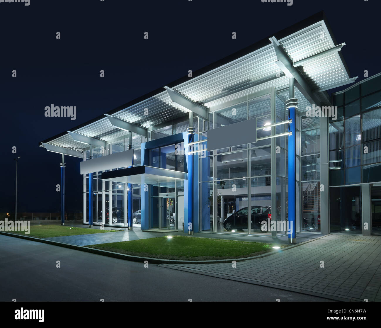 Exterior of a modern car salon, night scene Stock Photo - Alamy