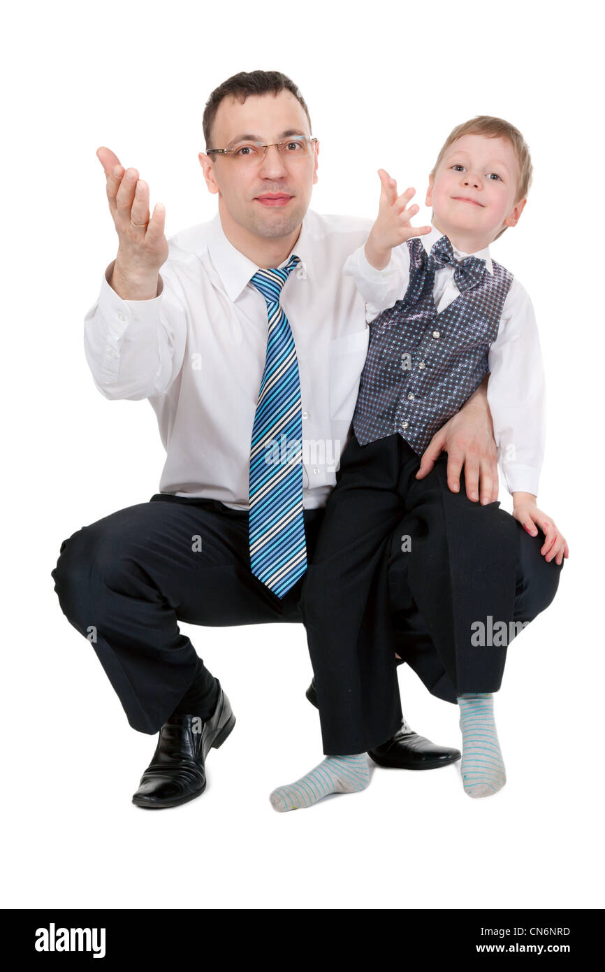 businessman and his son pulled his hands in the studio, isolate on ...