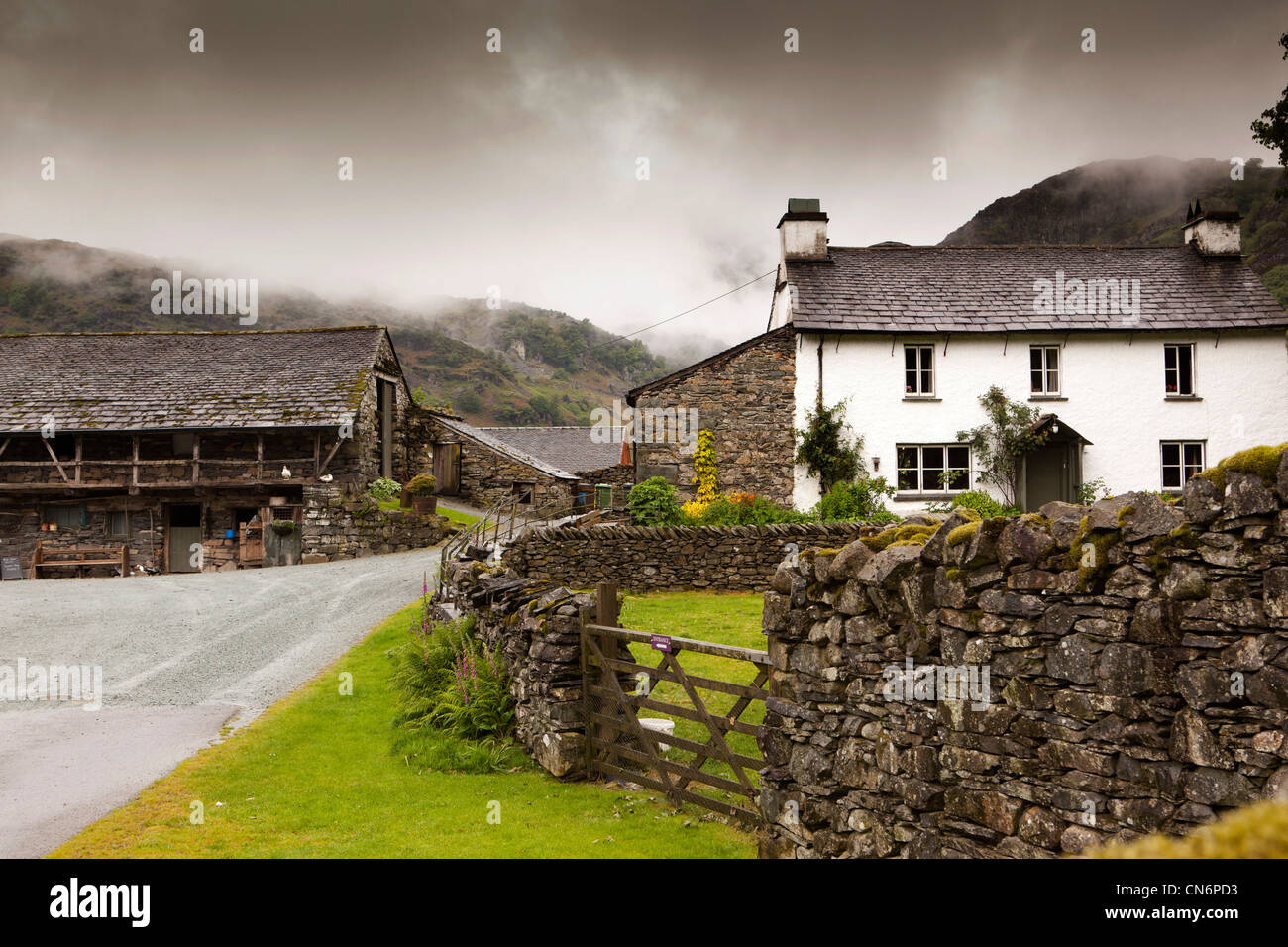 UK, Cumbria, Coniston, rain cloud approaching Yew Tree Farm, from Old ...