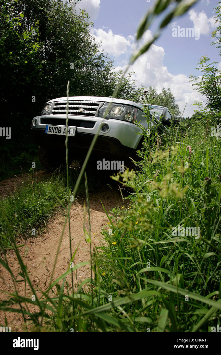 Range Rover drives over uneven, hilly conditions Stock Photo - Alamy