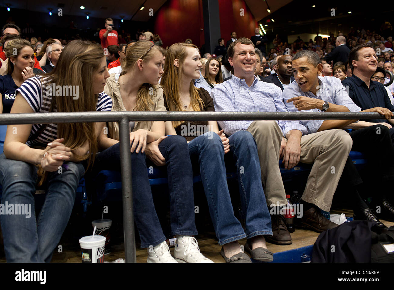 President Barack Obama talks with students during game one of the NCAA ...