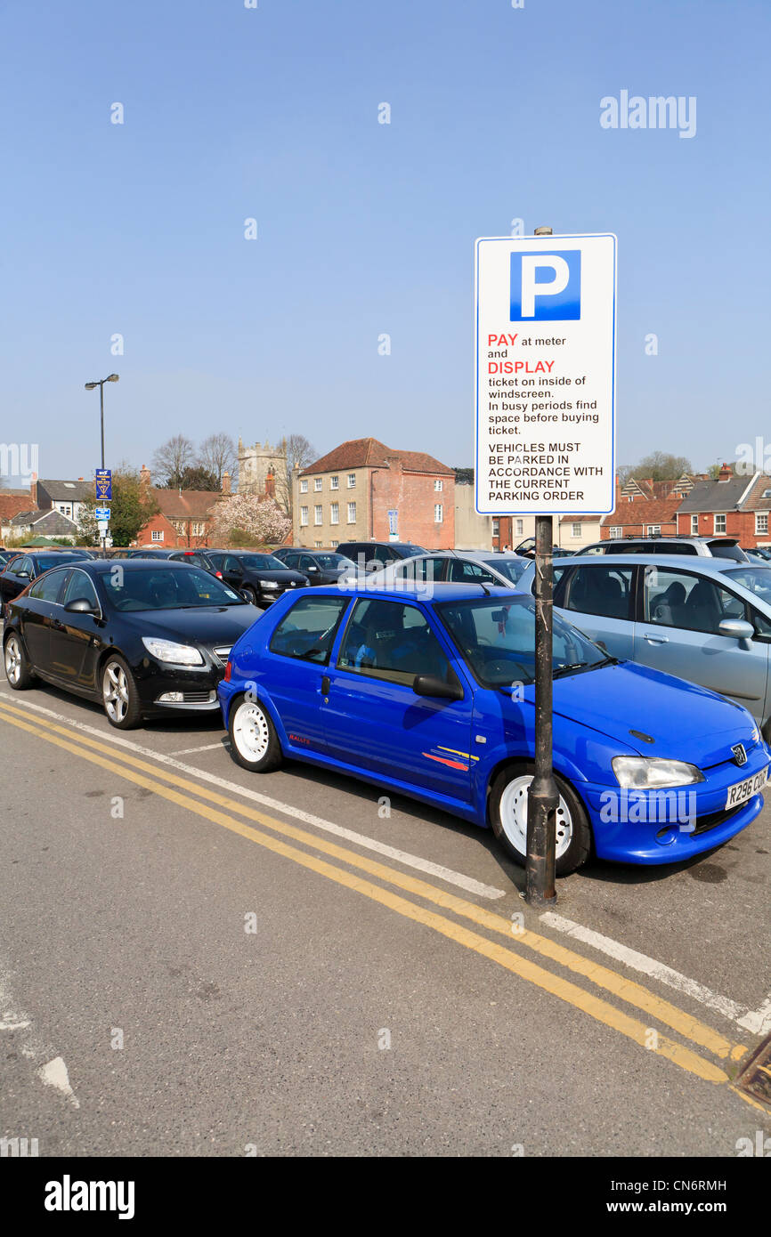 Public car park with cars and sign UK Stock Photo - Alamy