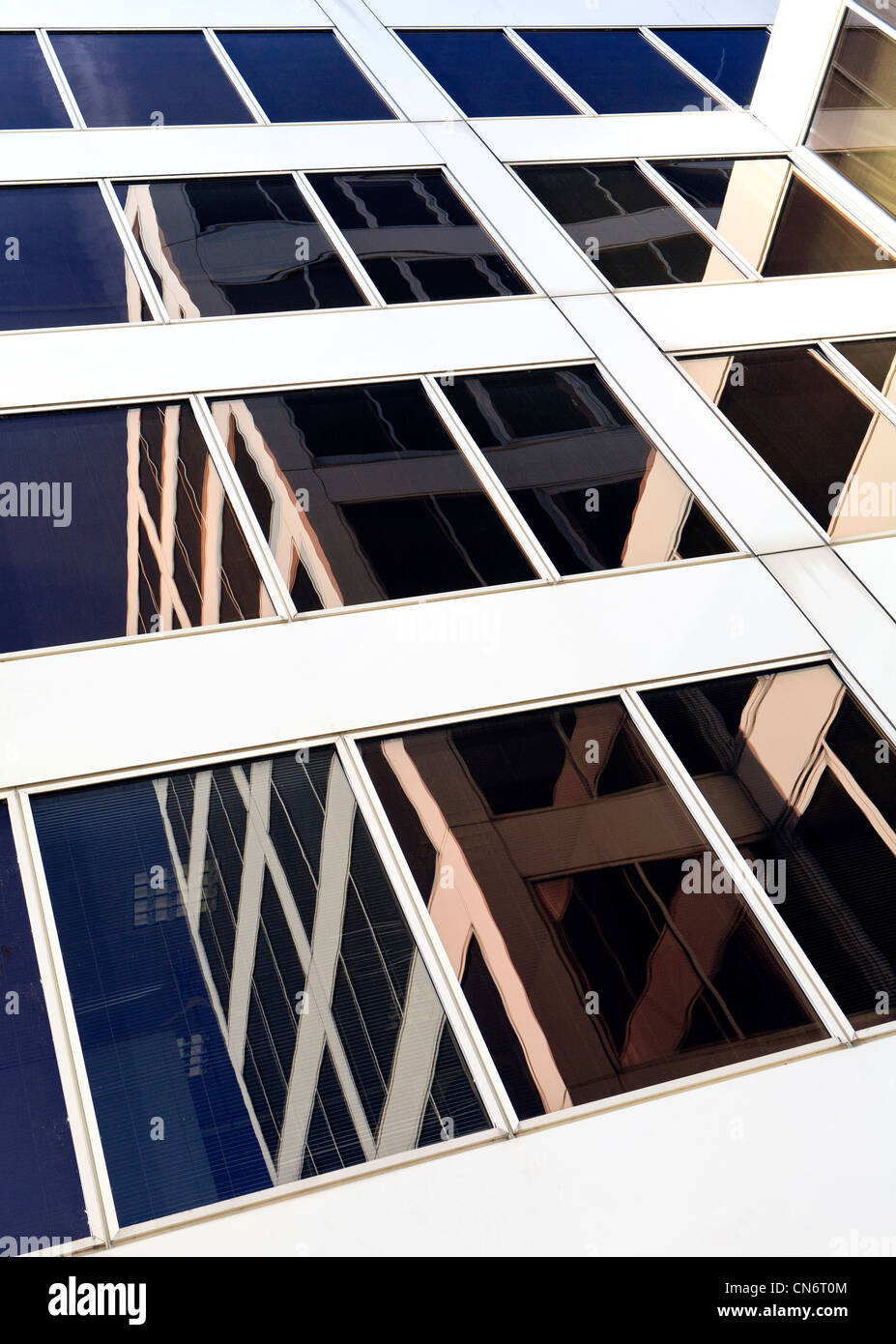 Reflections in windows of glass building Stock Photo - Alamy