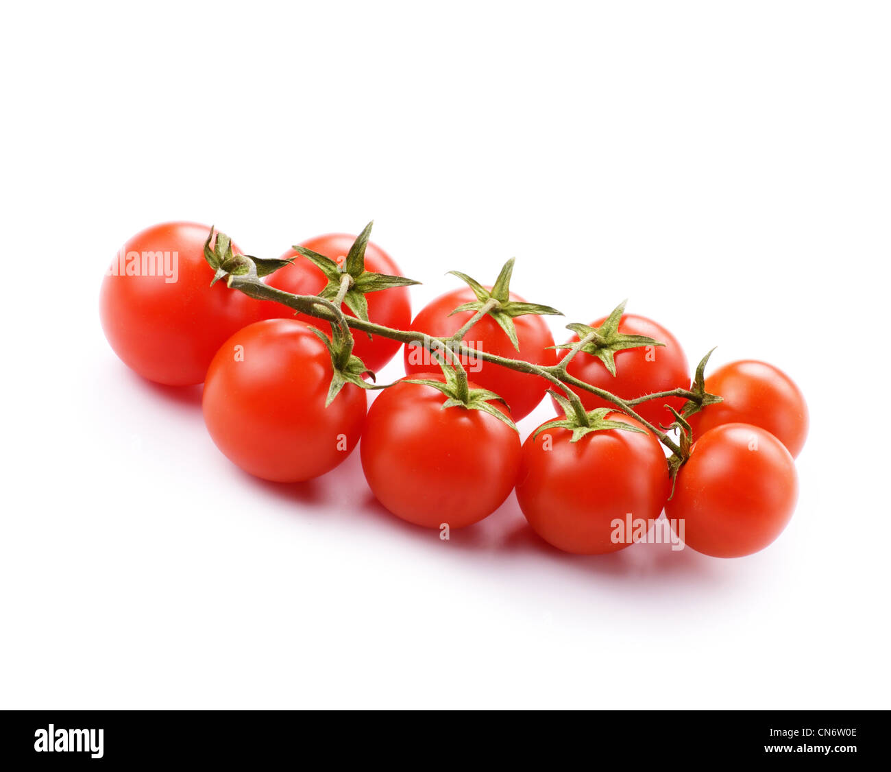 Cherry tomatoes closeup over white background Stock Photo - Alamy