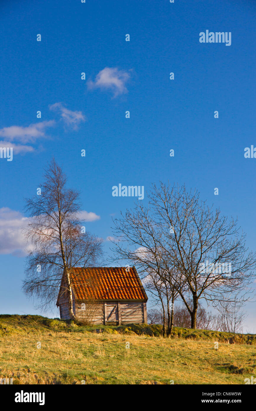 Picture of a small house on the top of a hill Stock Photo - Alamy