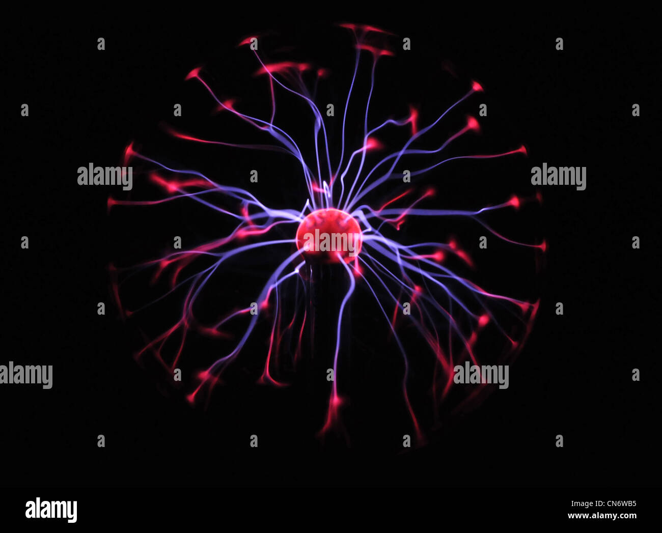 purple and red glows in glass magic plasma ball lamp Stock Photo - Alamy