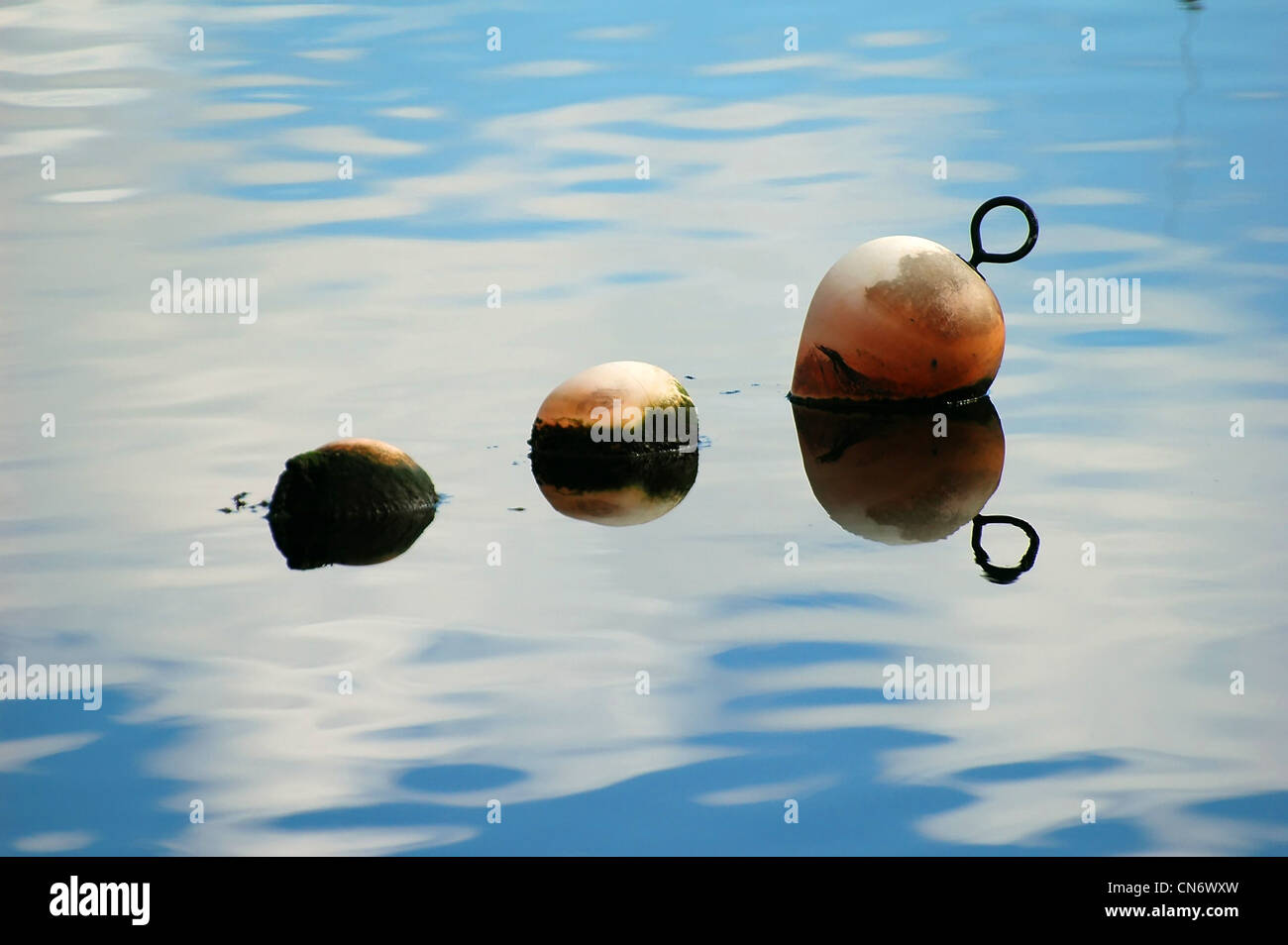 three red buoy in sea Stock Photo - Alamy