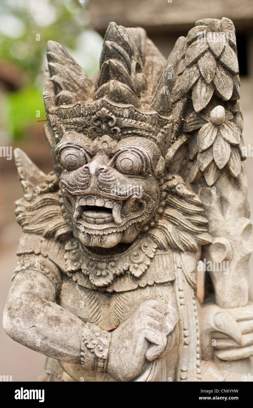 Statue of Balinese demon in Ubud, Indonesia Stock Photo - Alamy
