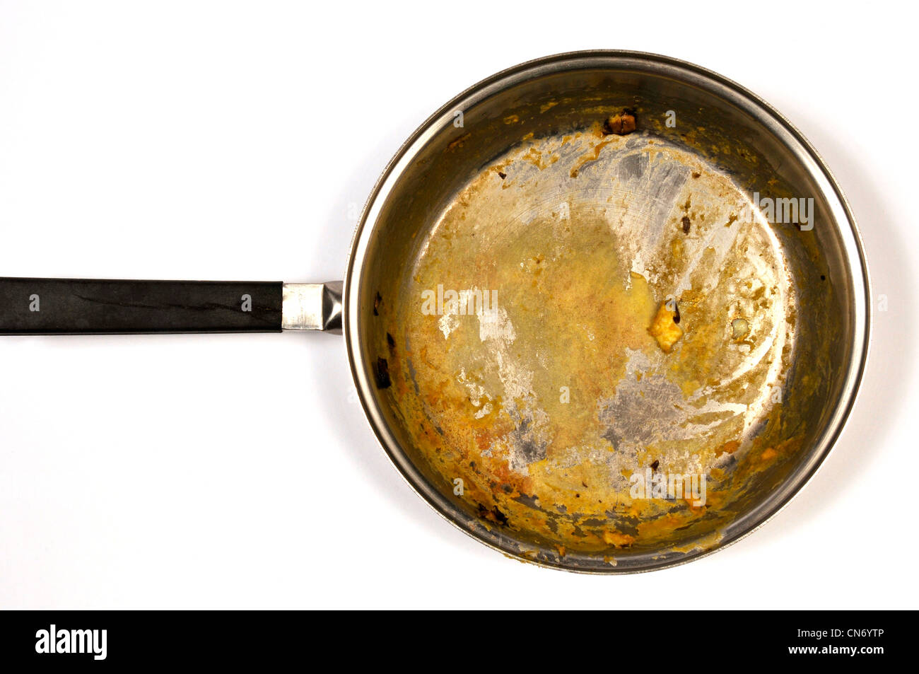 A dirty stainless steel pan used to cook eggs Stock Photo - Alamy