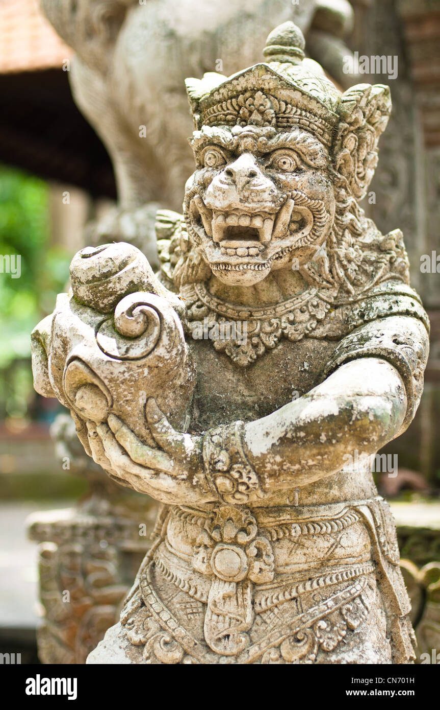Statue of Balinese demon in Ubud, Indonesia Stock Photo - Alamy