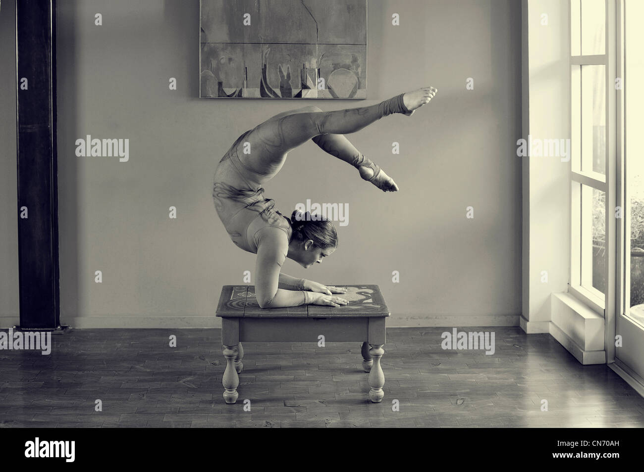 Female acrobat in artistic poise Stock Photo - Alamy