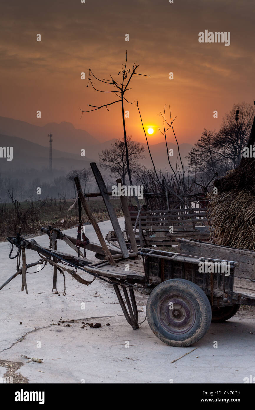 Sunset at the Shaolin temple village with a horse cart beside a farm ...