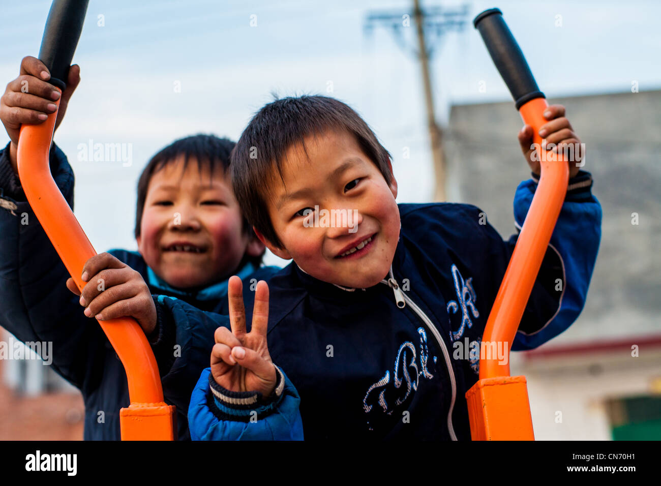 Chinese Kids playing in a small park in their village Stock Photo - Alamy