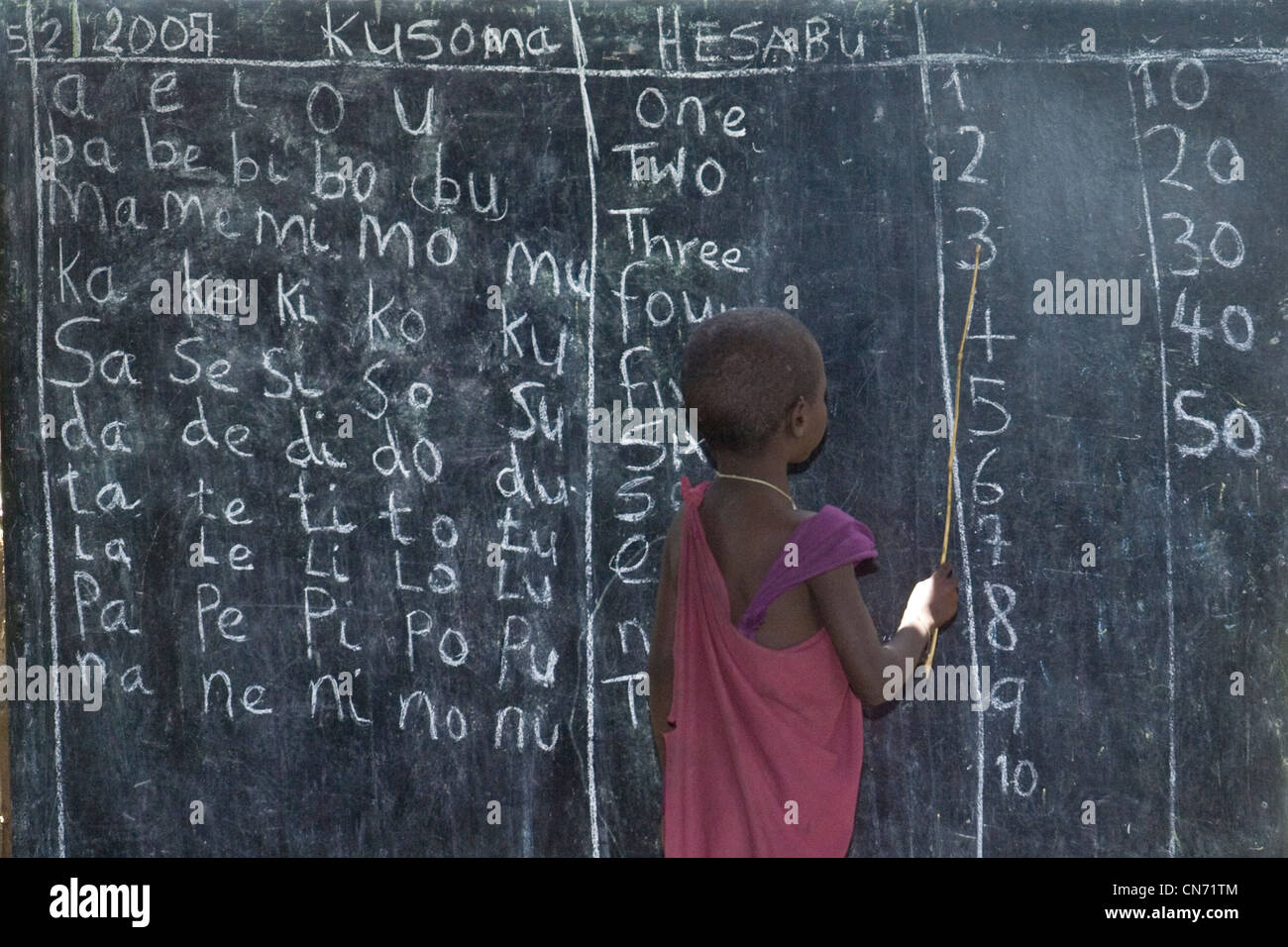 Masai child writing on blackboard Stock Photo - Alamy