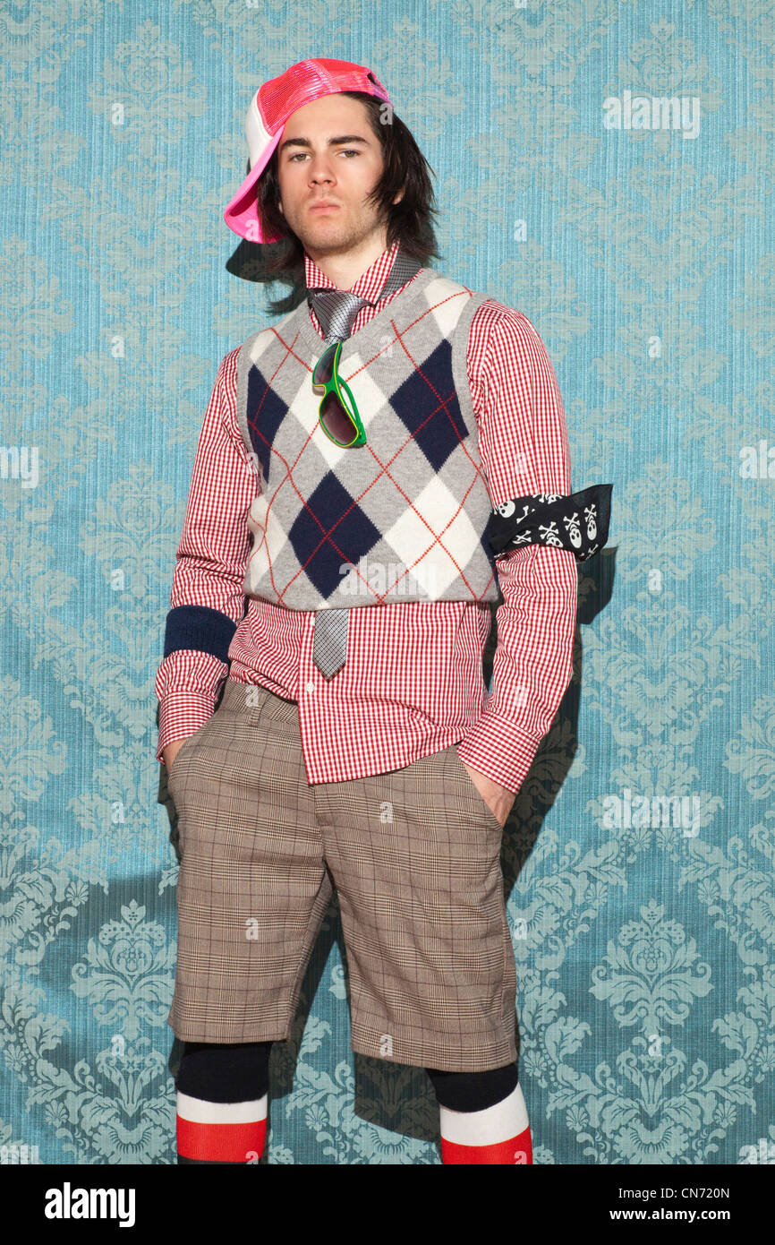 Portrait of caucasian young man wearing cap standing in front of ...