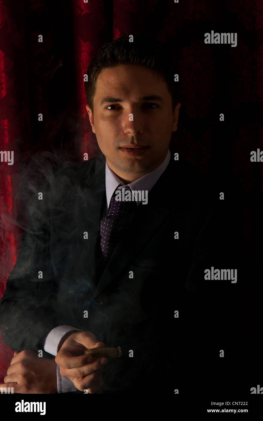 Handsome guy wearing suit smoking in night Stock Photo - Alamy