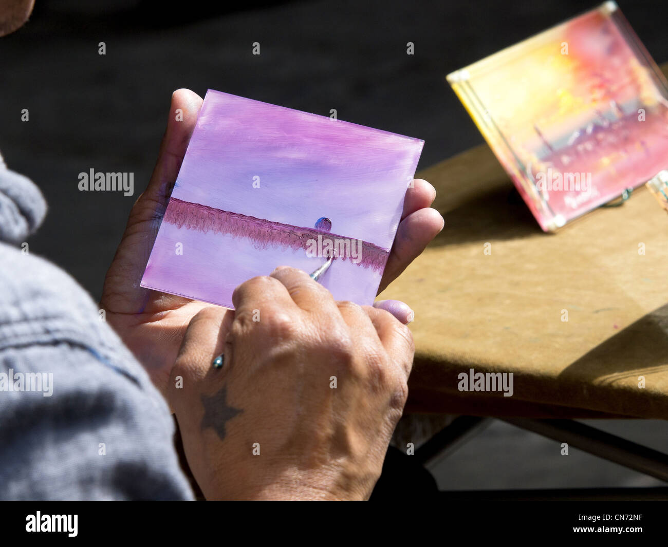 actor painting on the peace of glass Stock Photo - Alamy