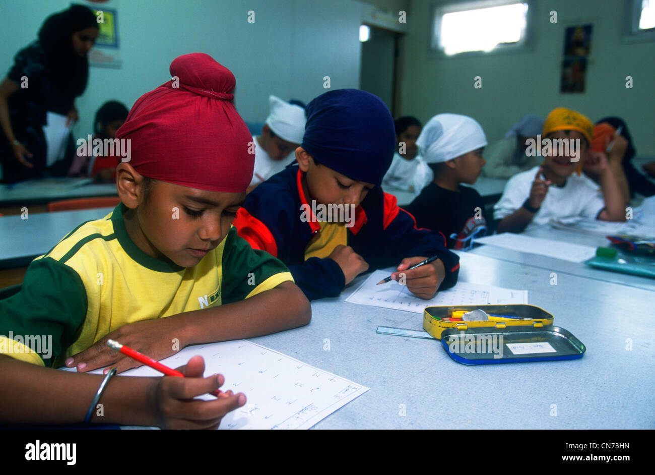 Sikh children in classroom at gurdwara learning Punjabi language, Sri ...