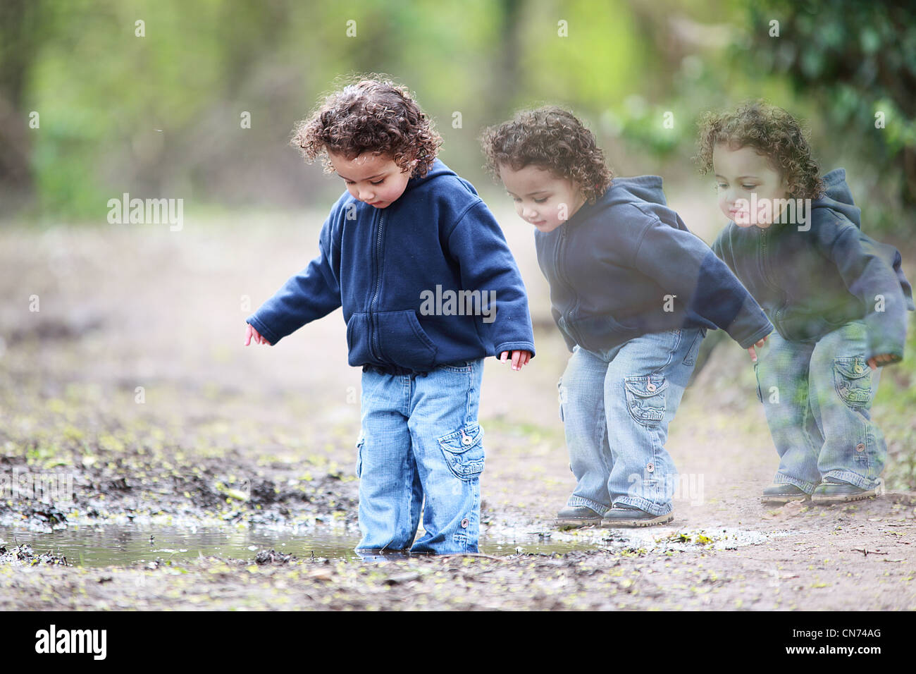 Child Jumping in Puddle Stock Photo - Alamy