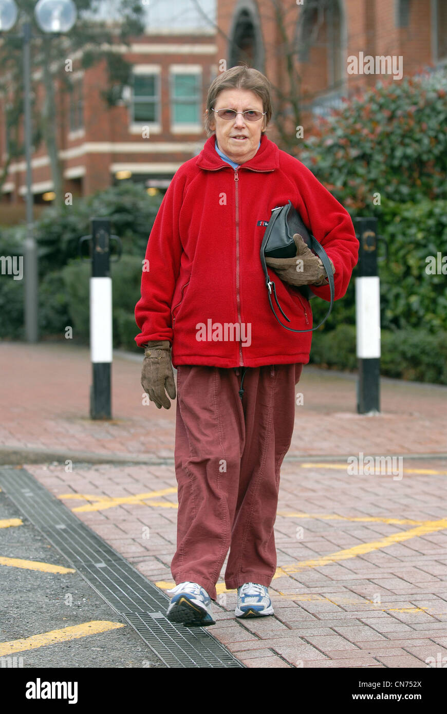 Old woman walking street uk hi-res stock photography and images - Alamy