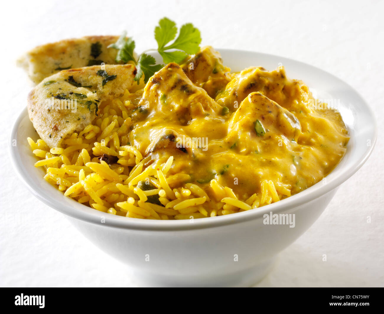 Chicken korma Curry with pilau rice Stock Photo - Alamy