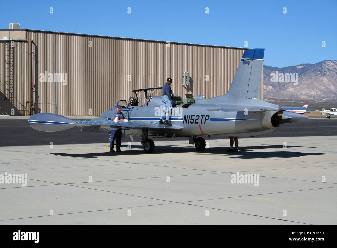 Mechanics working on an Aermacchi MB-326 Impala at Mojave airfield ...