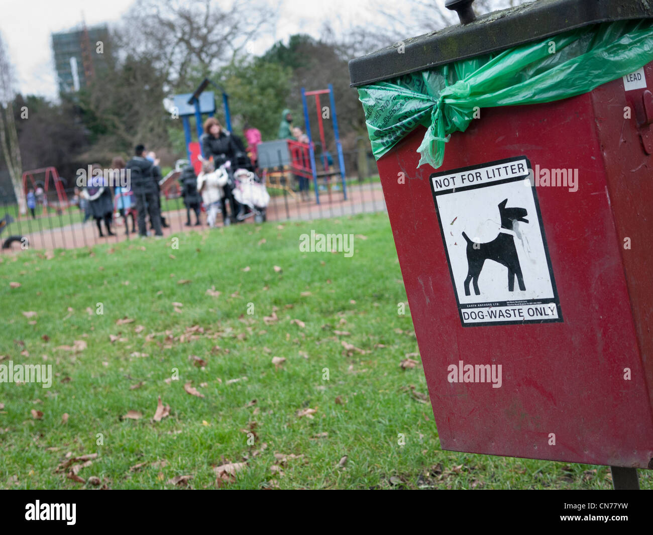 Dog waste, poop bin in park by, near to children's play area Stock ...