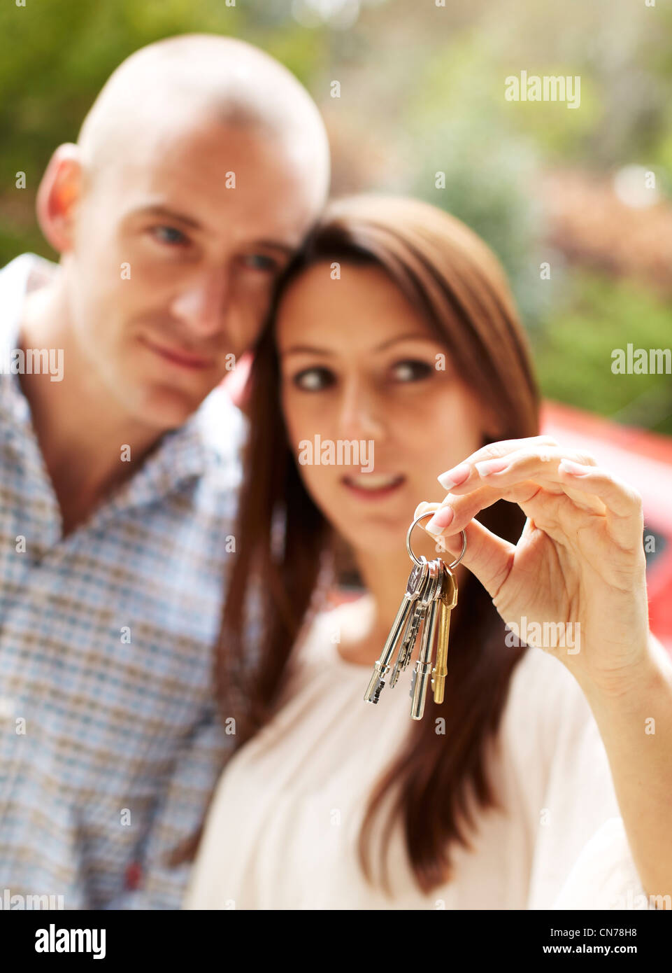 Couple holding keys Stock Photo - Alamy