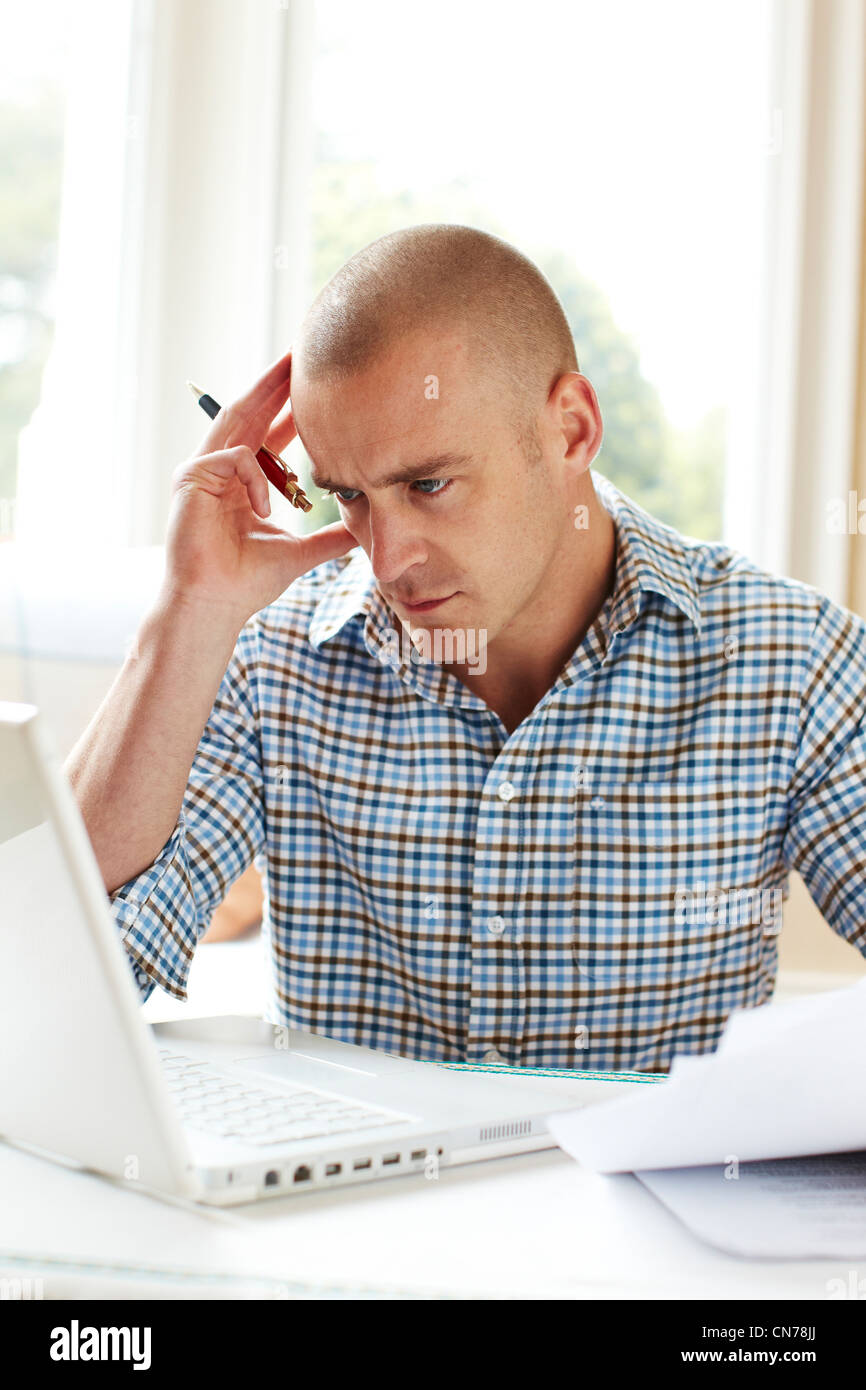 Young man working computer hi-res stock photography and images - Alamy